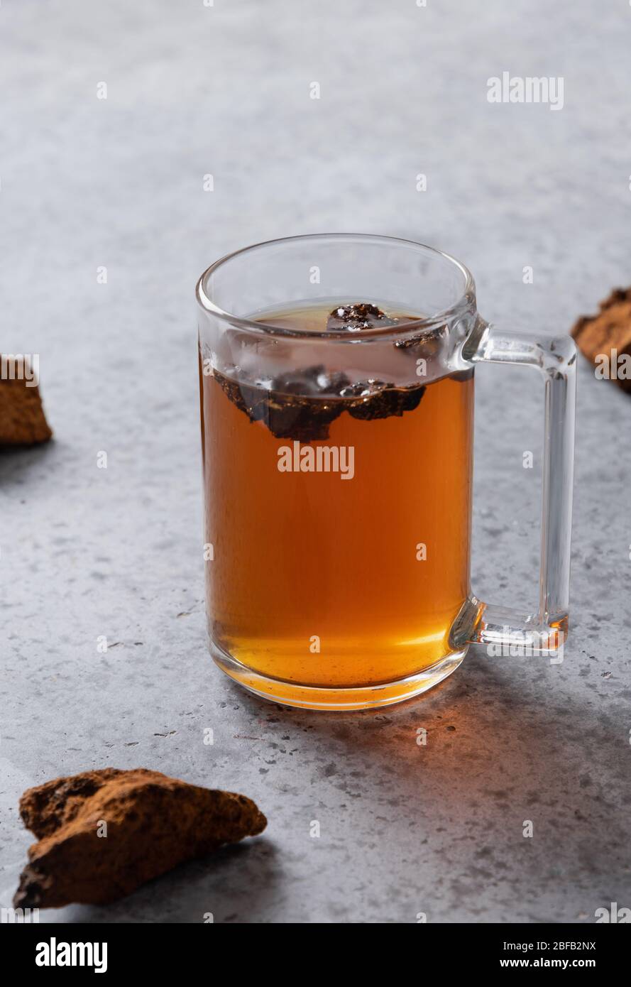 Organic Chaga tea in cup. Trendy Russian healthy infusion from birch ...