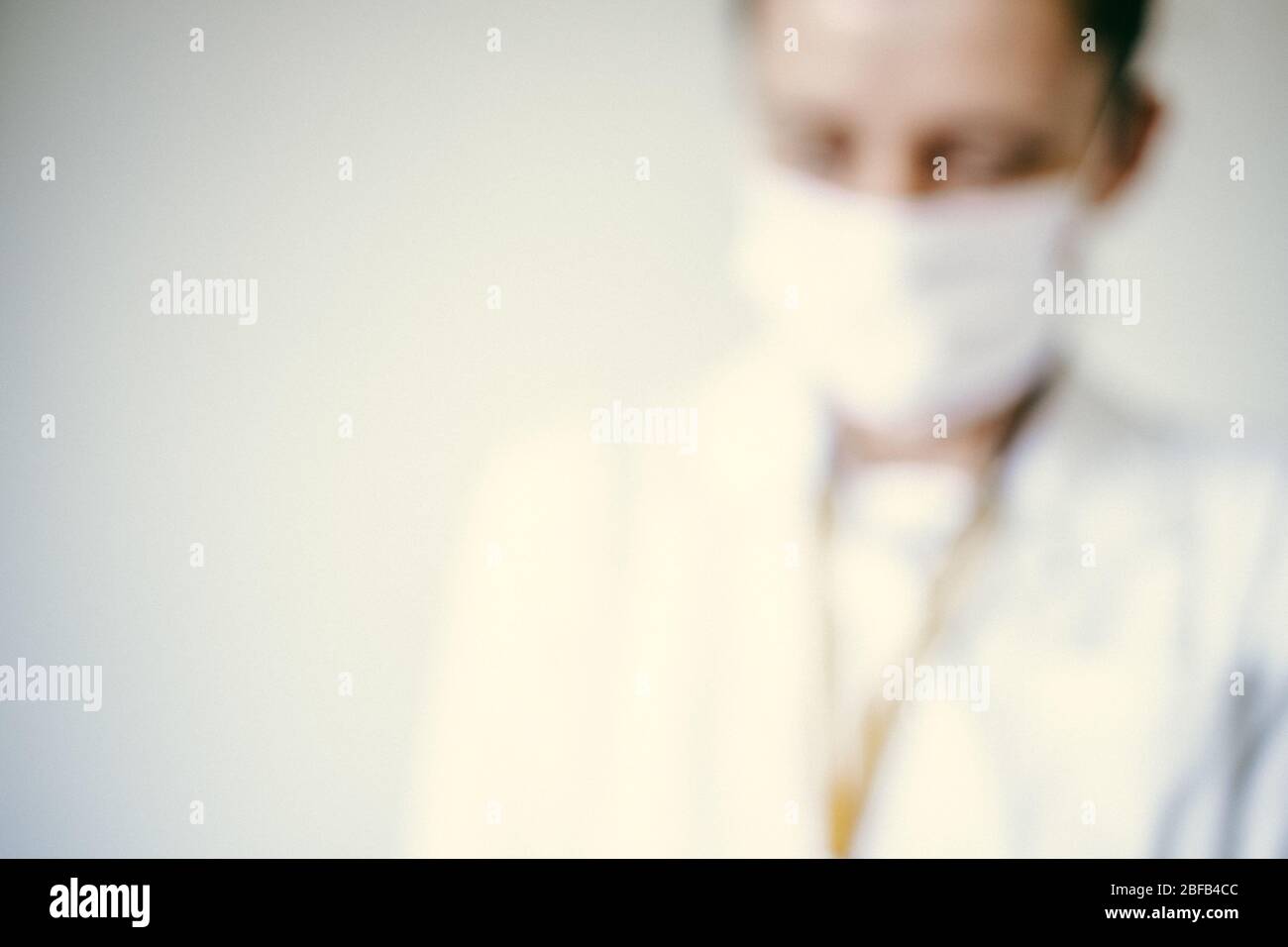 blurred image of a doctor wearing mask Stock Photo - Alamy