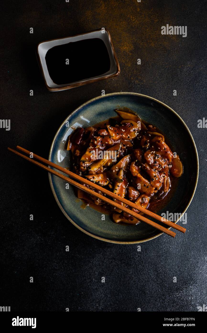 Traditional chinese food with sweet and sour pork served on a concrete ...