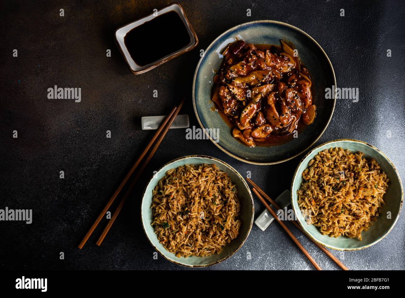 Traditional chinese food with sweet and sour pork and fries rice served ...