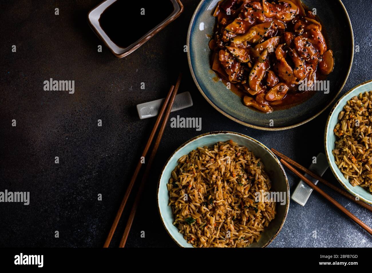 Traditional chinese food with sweet and sour pork and fries rice served ...