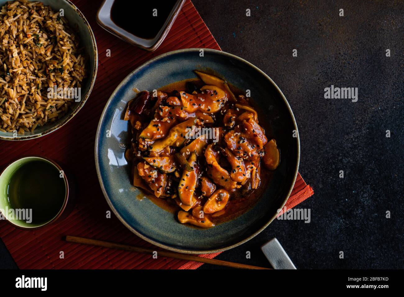 Traditional chinese food with sweet and sour pork and fries rice served ...