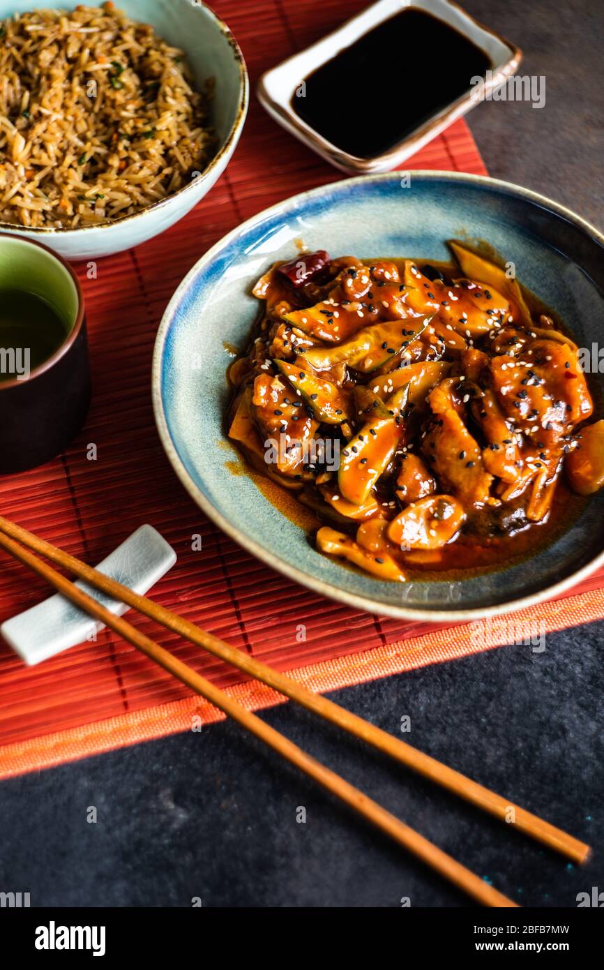 Traditional chinese food with sweet and sour pork and fries rice served ...