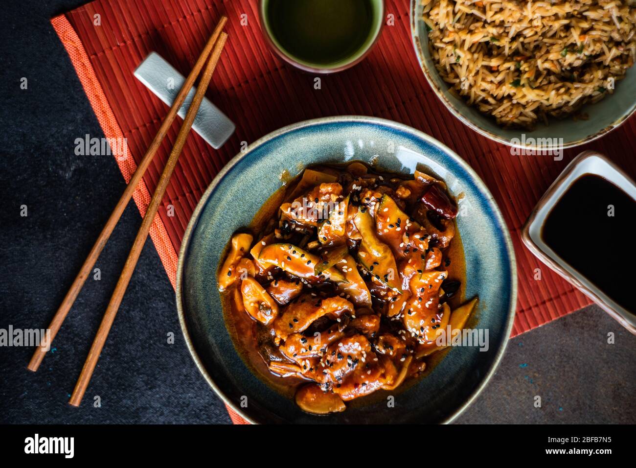 Traditional chinese food with sweet and sour pork and fries rice served ...