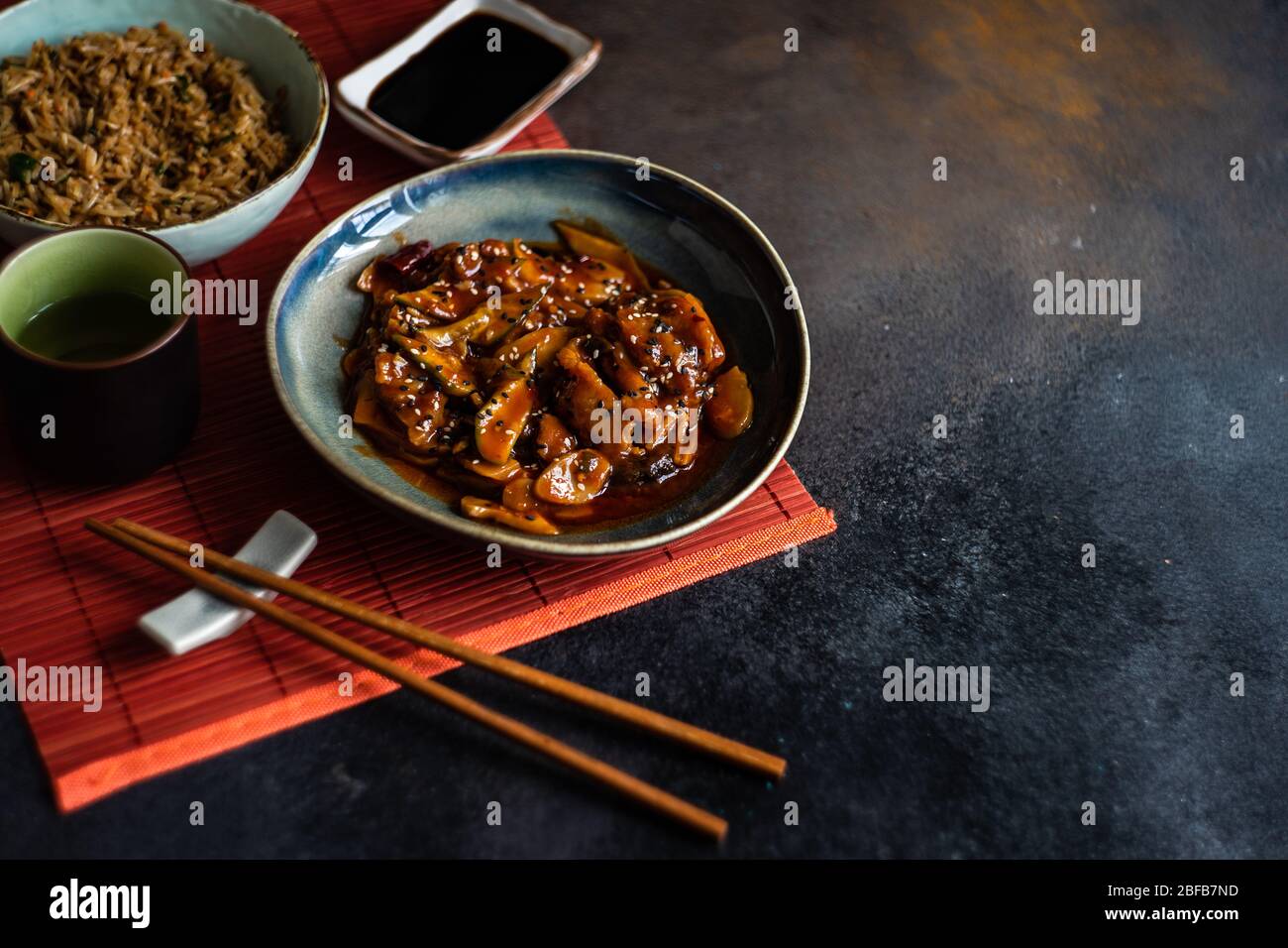 Traditional chinese food with sweet and sour pork and fries rice served ...