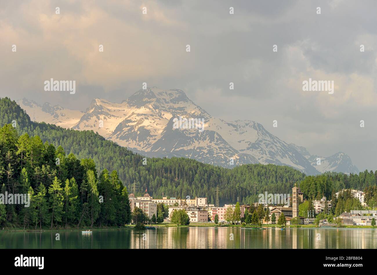 Lake St.Moritz in Spring with St.Moritz Bath and Piz Margna in the ...