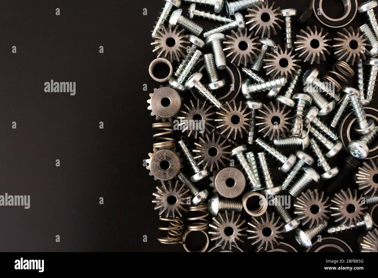 Background with mechanical components, gears, springs, screws ...