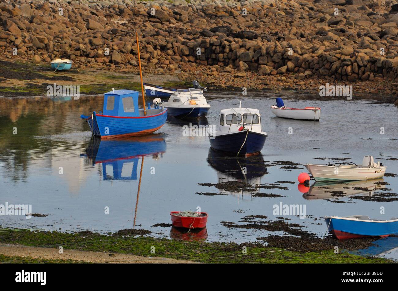 Boats at low tide in the Old Town harbour on St Marys, Isles of Scilly ...