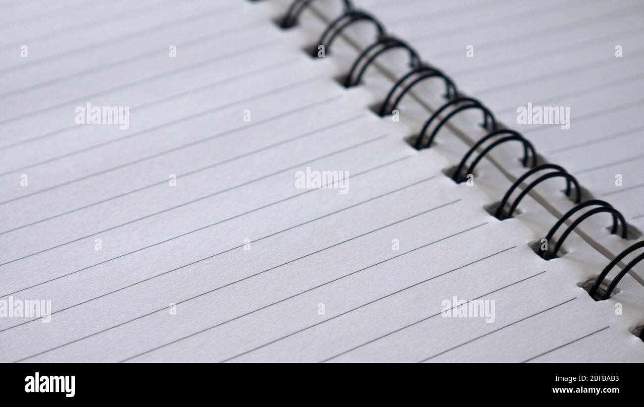 Close up top view of spiral notepad paper background Stock Photo - Alamy