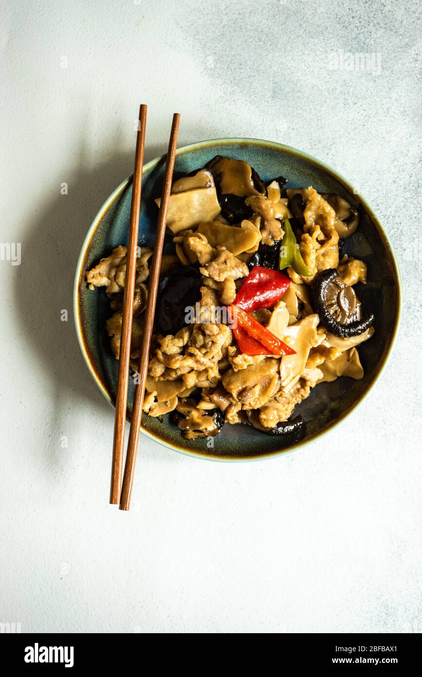 Traditional chinese food chicken with mushrooms and vegetables served ...