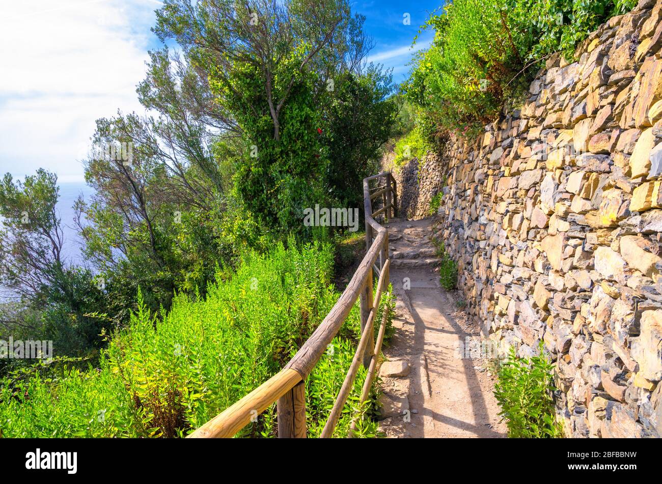 Pedestrian hiking stone path trail with railing between Corniglia and ...