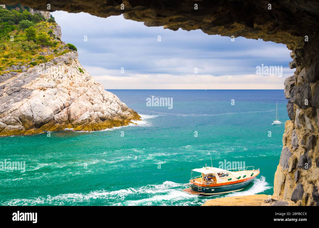 View of Ligurian sea water, rock cliff of Palmaria island and yacht ...