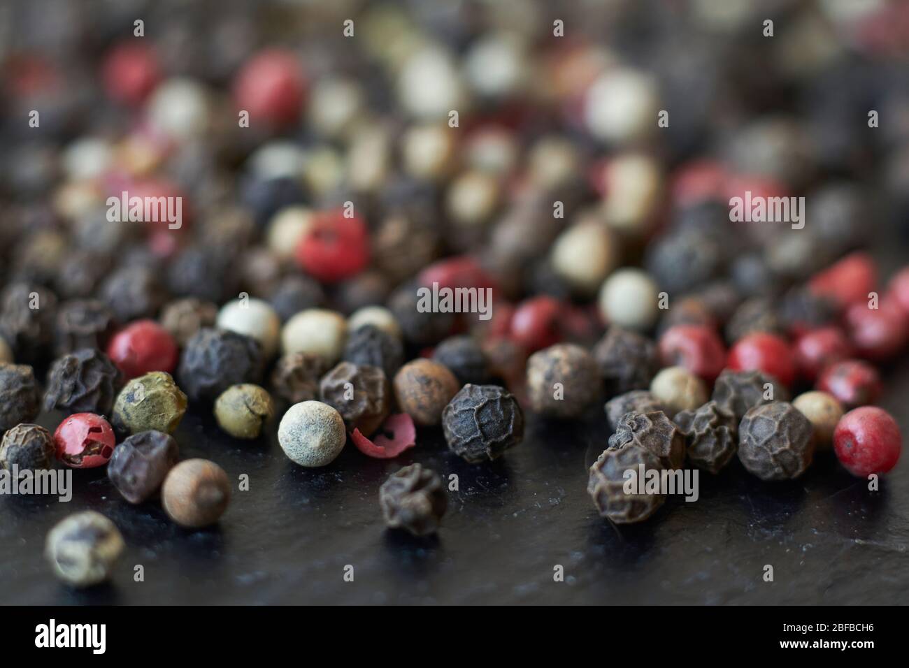 Pepper spice texture. Multicolored pepper corns, mix of colorful grains ...