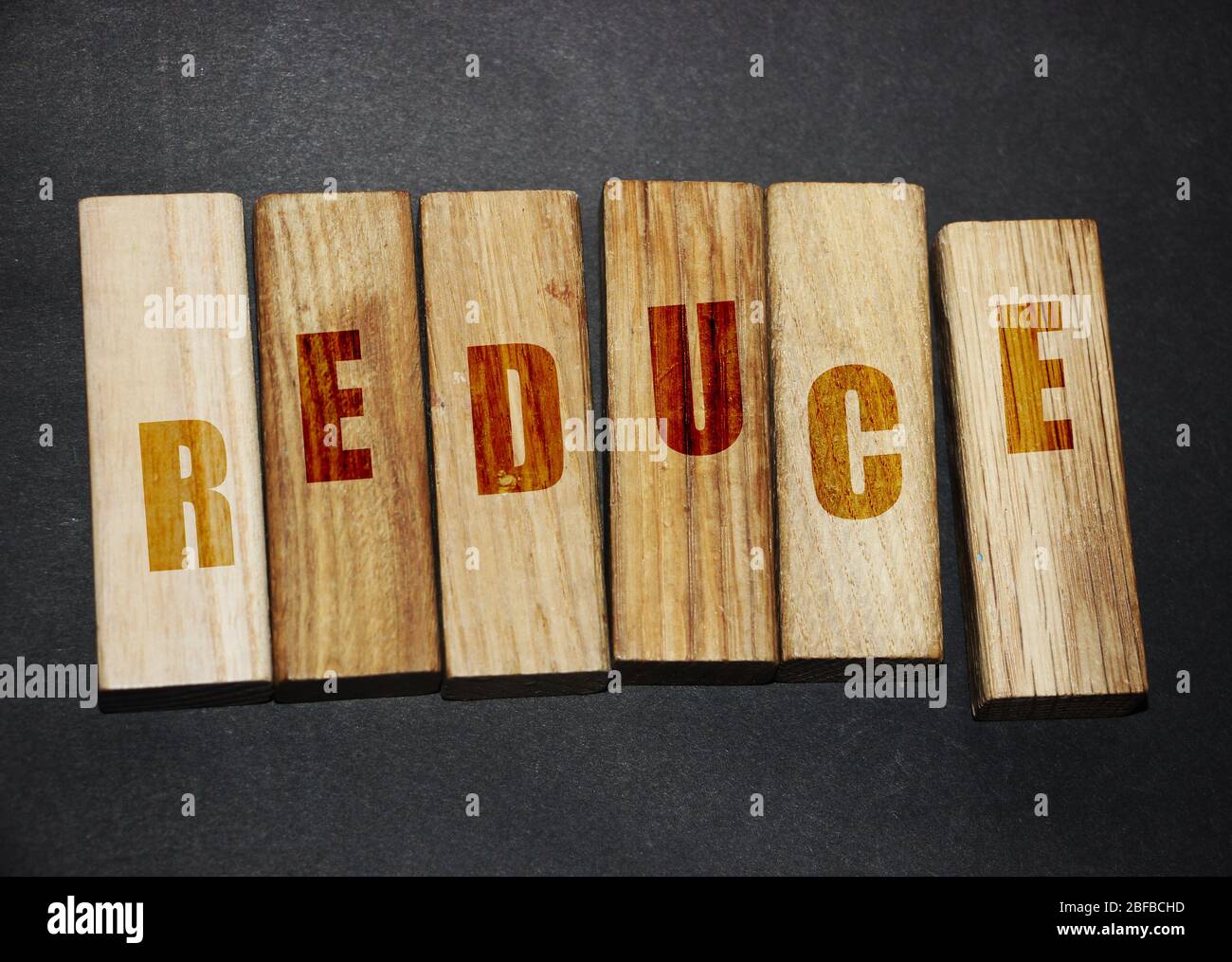 Reduce word letters on wooden blocks,. Resource conservation Reduce ...