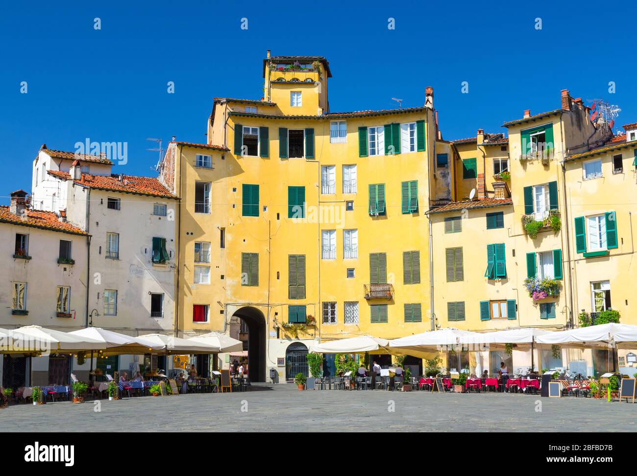 Piazza dell Anfiteatro square in circus yard of medieval town Lucca ...