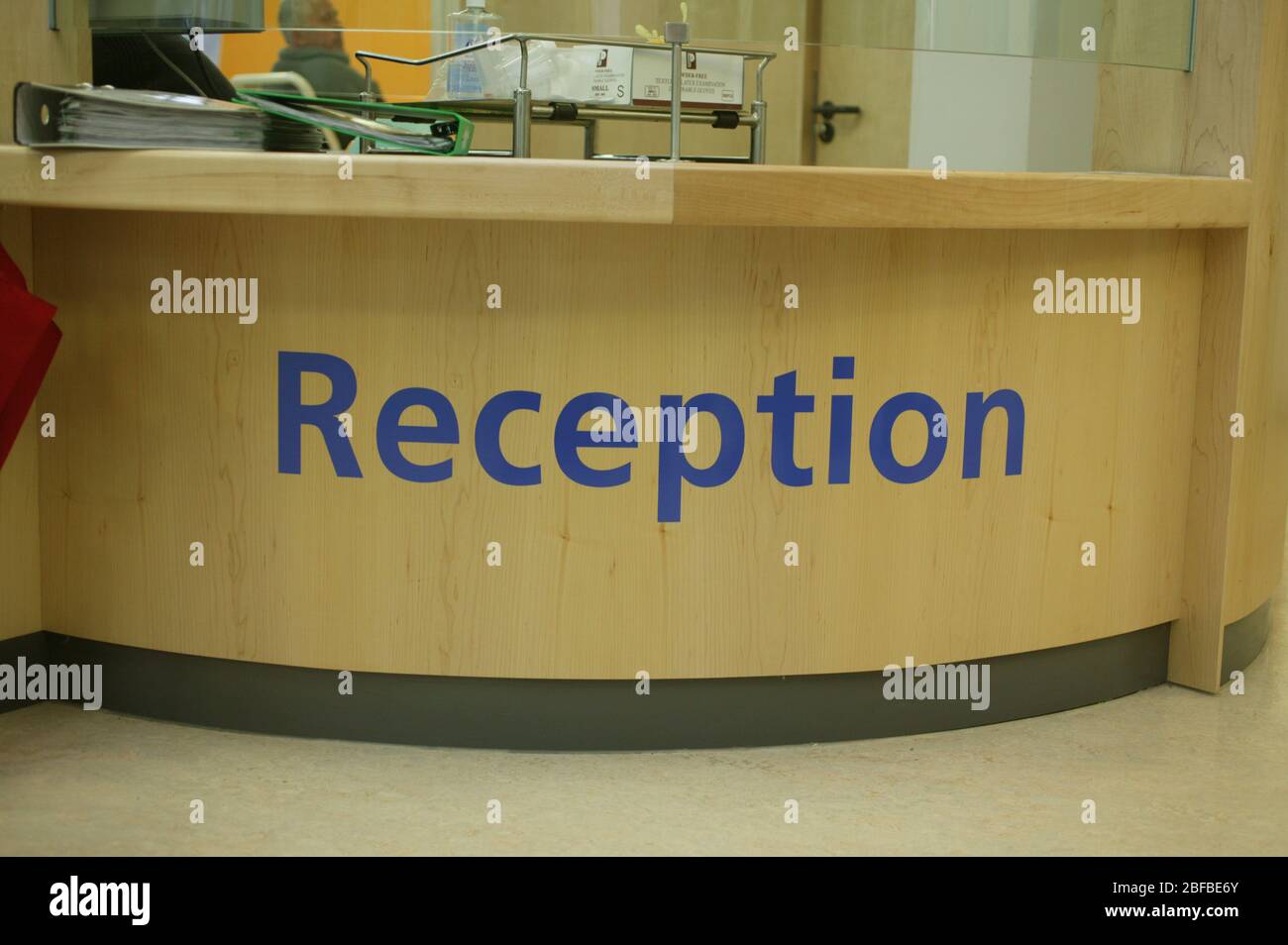 Reception desk at a hospital Stock Photo - Alamy