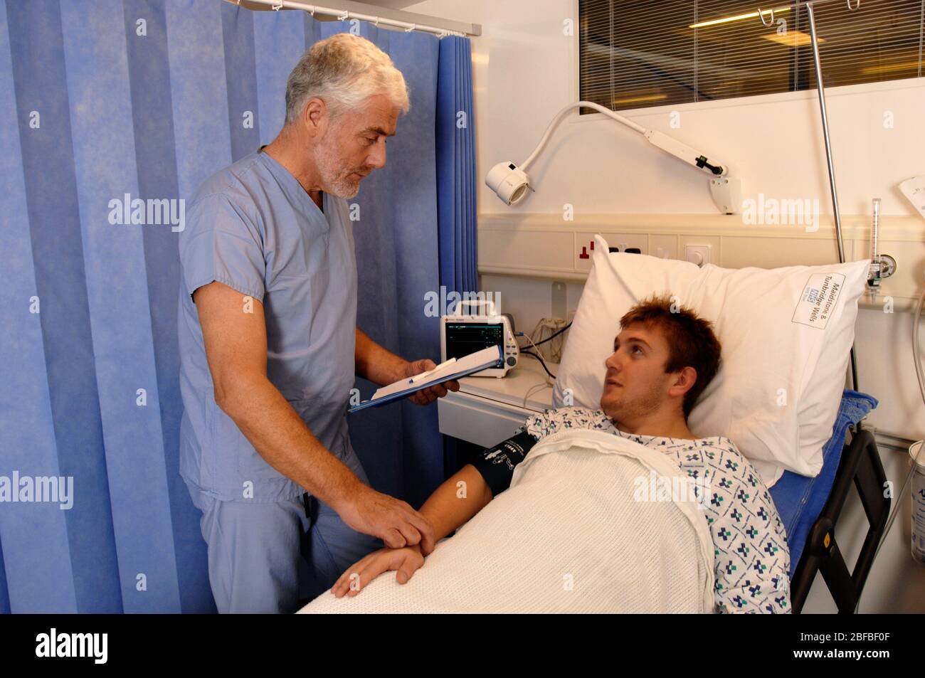 Bearded Surgeon Visiting Male Patient Recovering High Resolution Stock ...