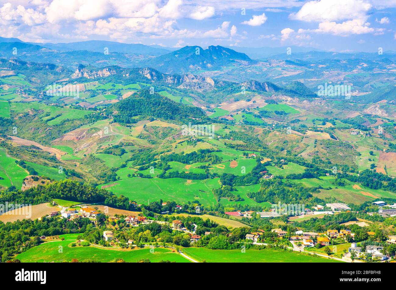 Aerial top panoramic view of landscape with valley, green hills, fields ...