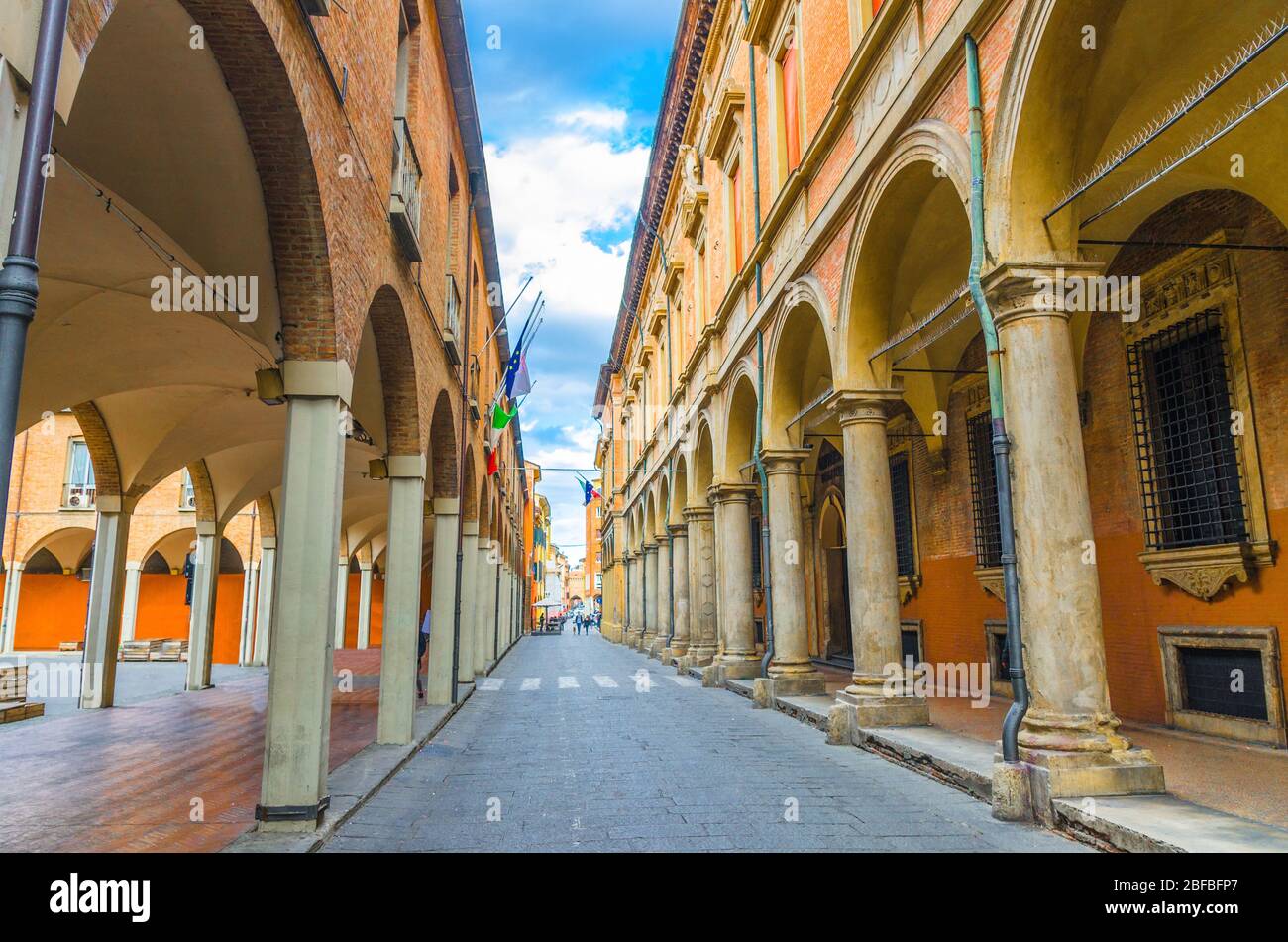Typical italian street, buildings with columns, Palazzo Poggi museum ...