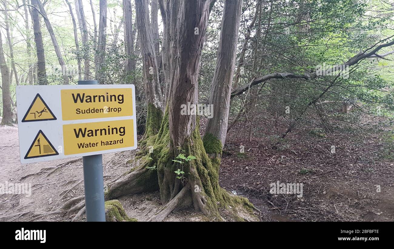 Warning sudden drop water hazard sign Stock Photo - Alamy
