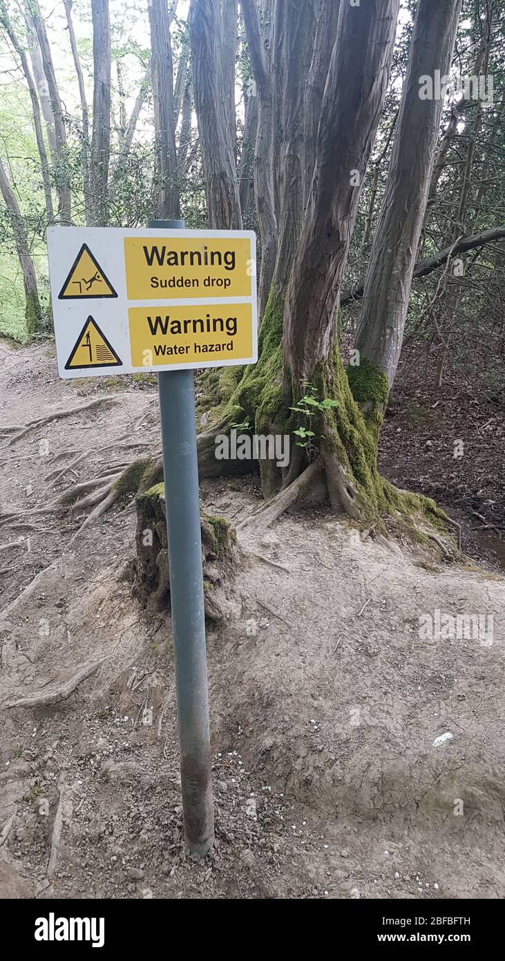 Warning sudden drop water hazard sign Stock Photo - Alamy