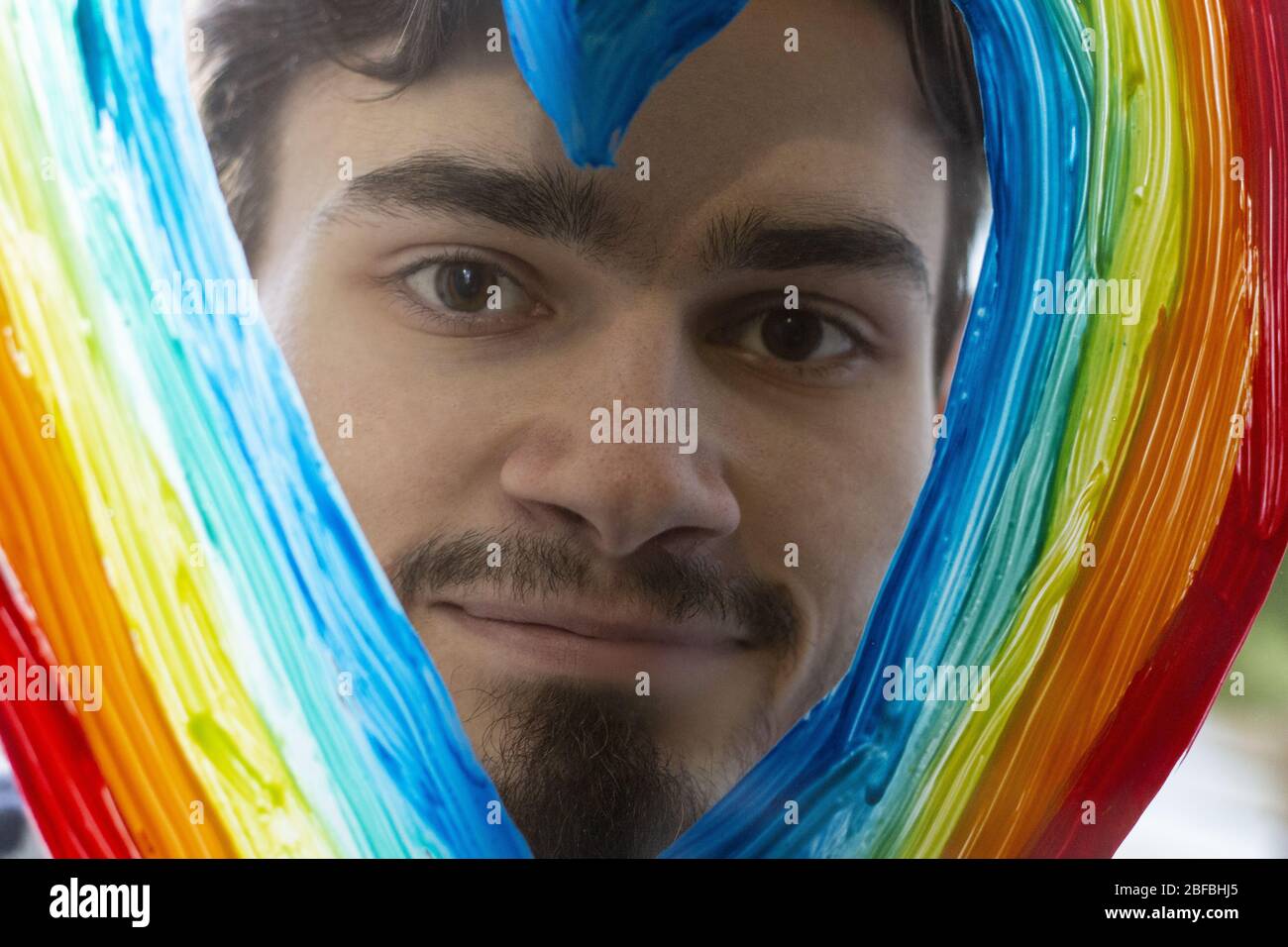 Look at the rainbow guy. The guy is looking out the window. Rainbow ...