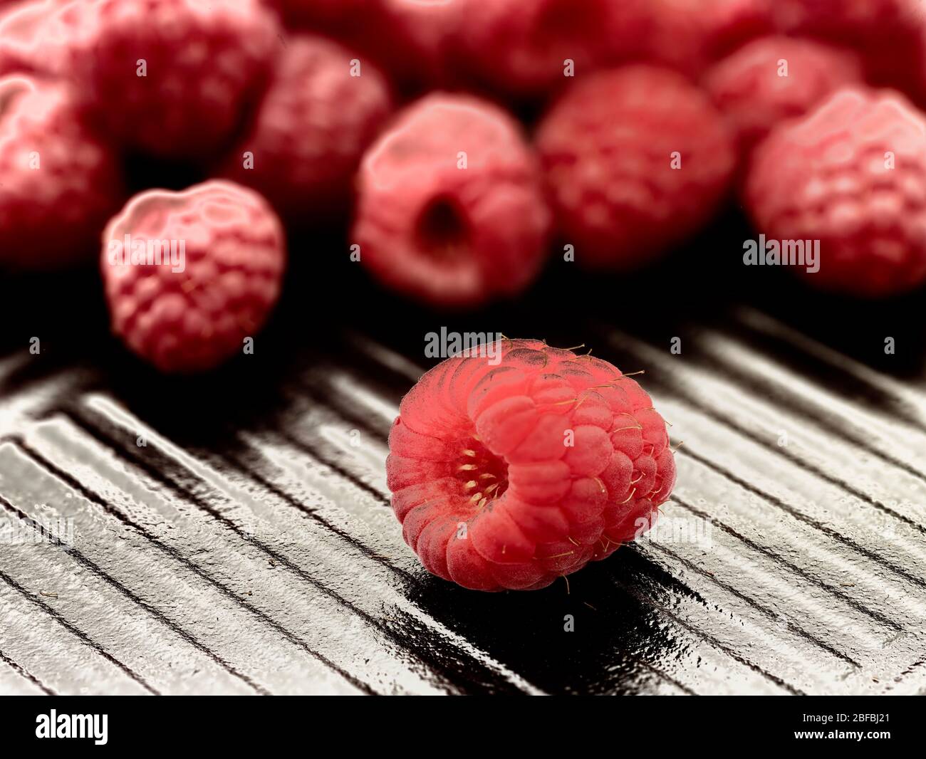 Raspberry fruit on plain background, fruit/food close-up portrait Stock ...
