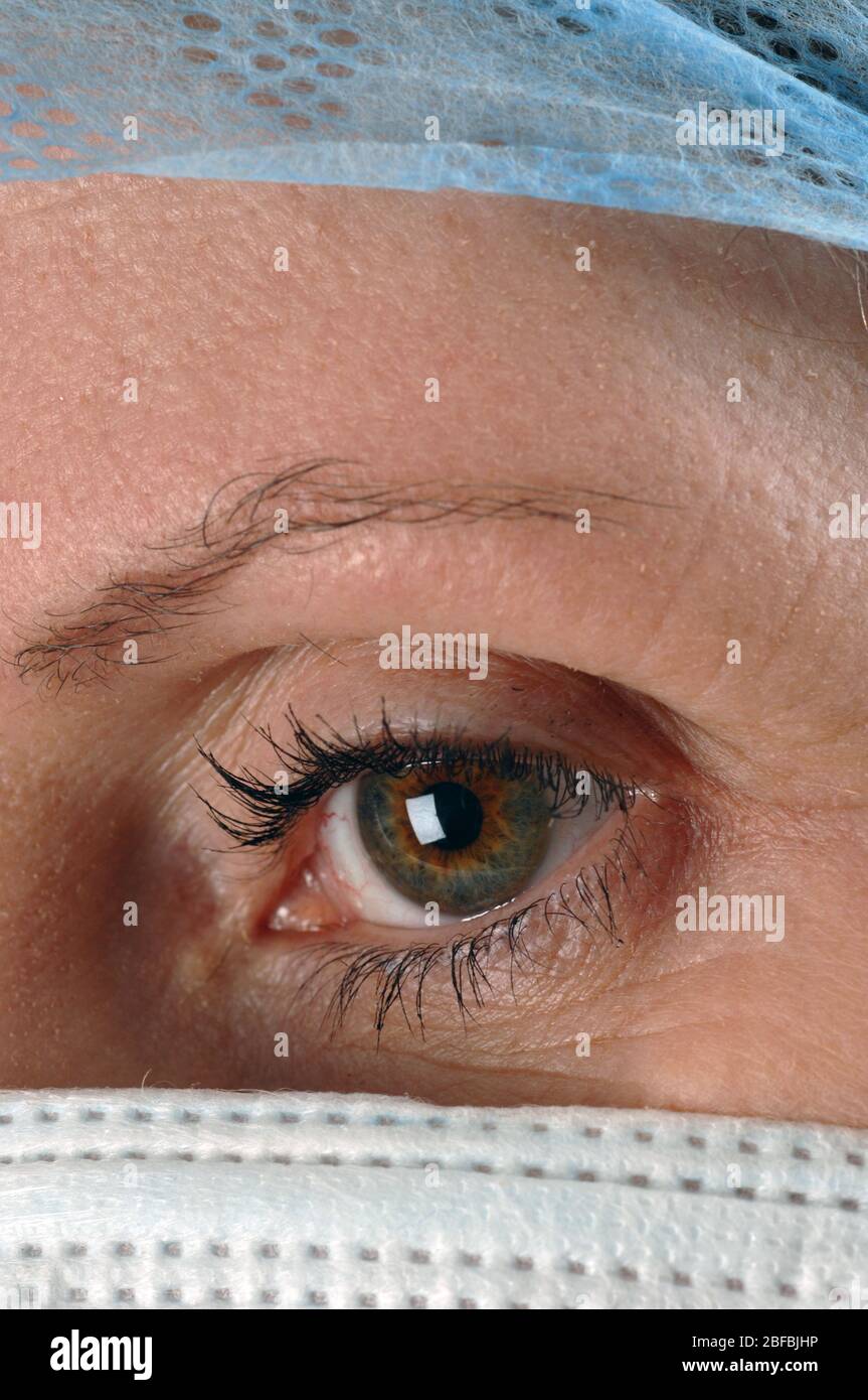 Close up of a hospital worker's eye and eyebrow, also showing part of ...