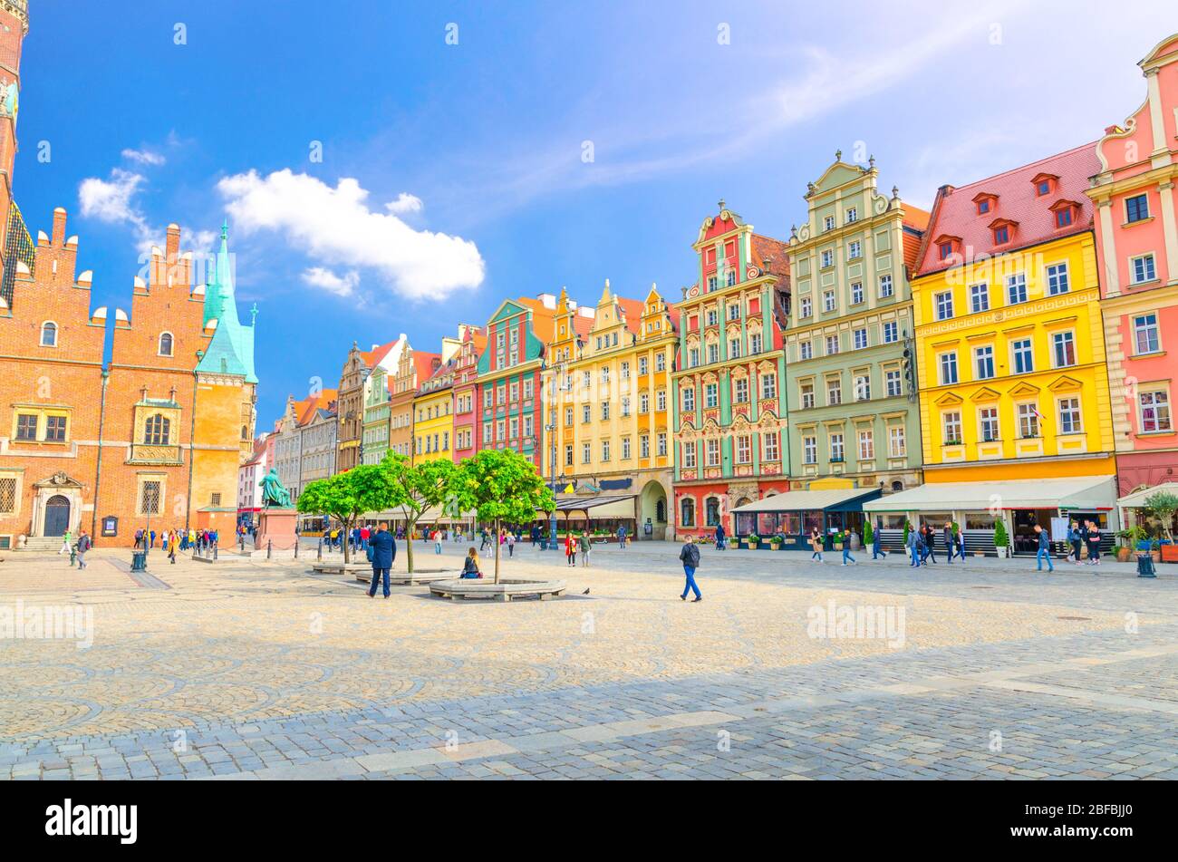 Row of colorful buildings with multicolored facade and Old Town Hall ...