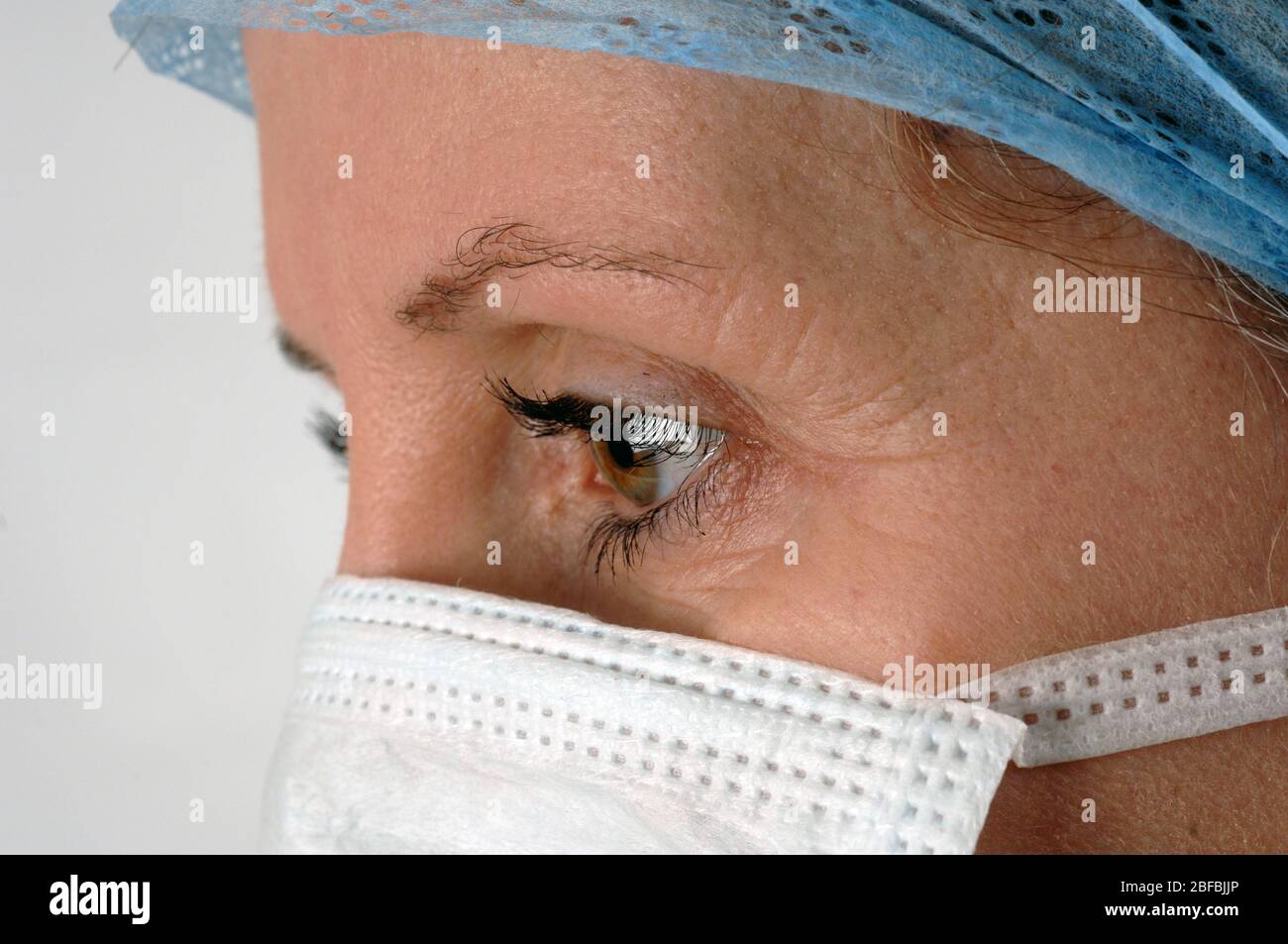 Close up of a hospital worker's eye and eyebrow, also showing part of ...