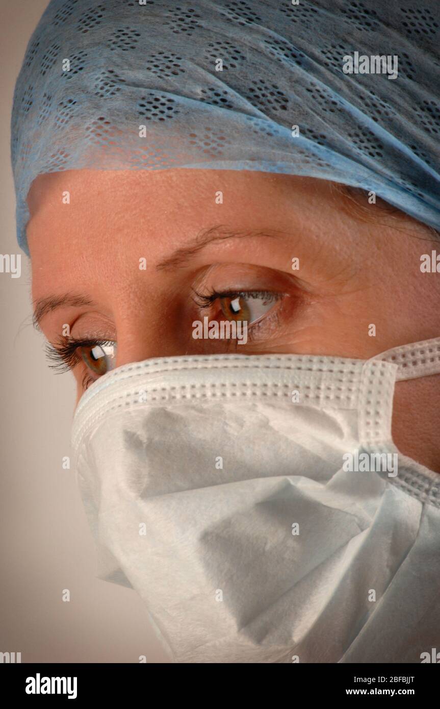 Close up of a hospital worker wearing a hygiene mask and hat Stock ...