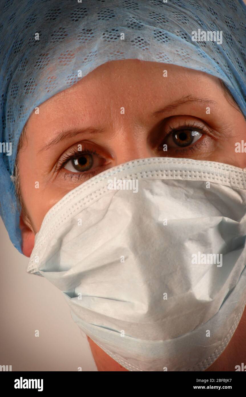 Close up of a hospital worker wearing a hygiene mask and hat Stock ...