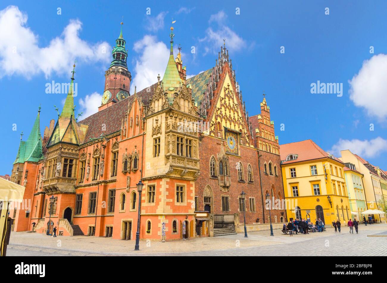 Old Town Hall gothic building with clock tower spire on cobblestone ...