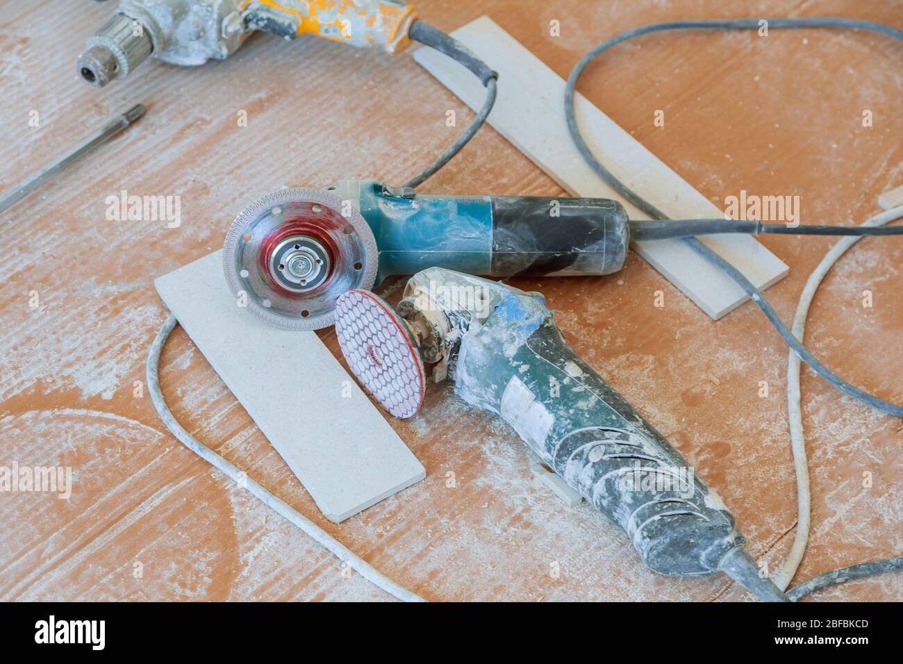 Small grinder with disc for cutting ceramics tiles construction tile ...