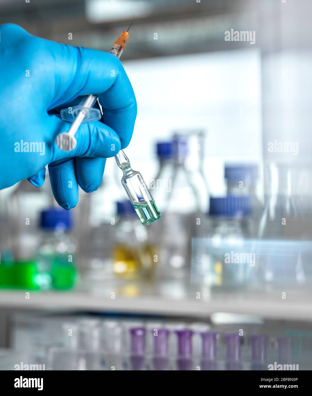 Pharmaceutical research. Scientist developing a new drug or vaccine in ...