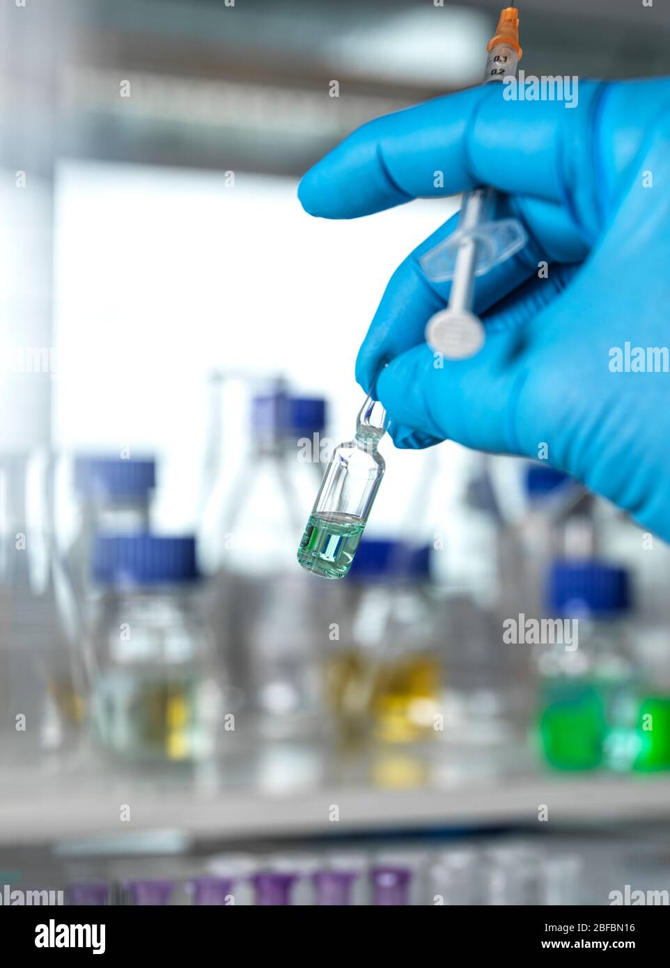 Pharmaceutical research. Scientist developing a new drug or vaccine in ...