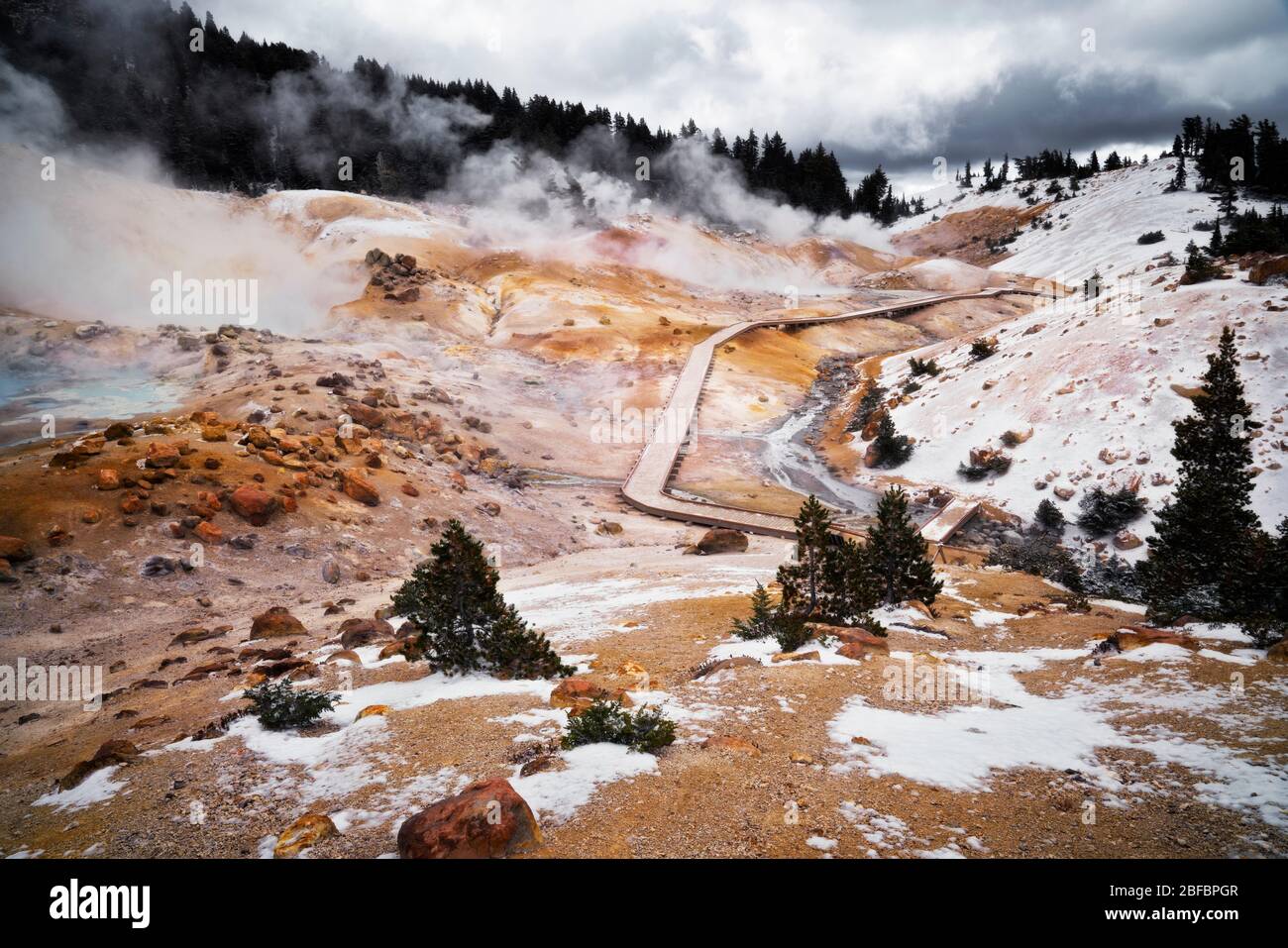 Steam rises from the many geothermal features seen from the boardwalk ...