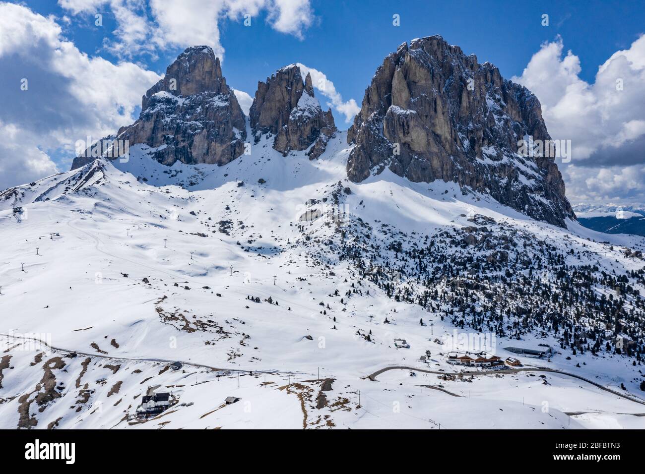 Aerial view of the Dolomites snow-covered mountains in Italy at sunny ...