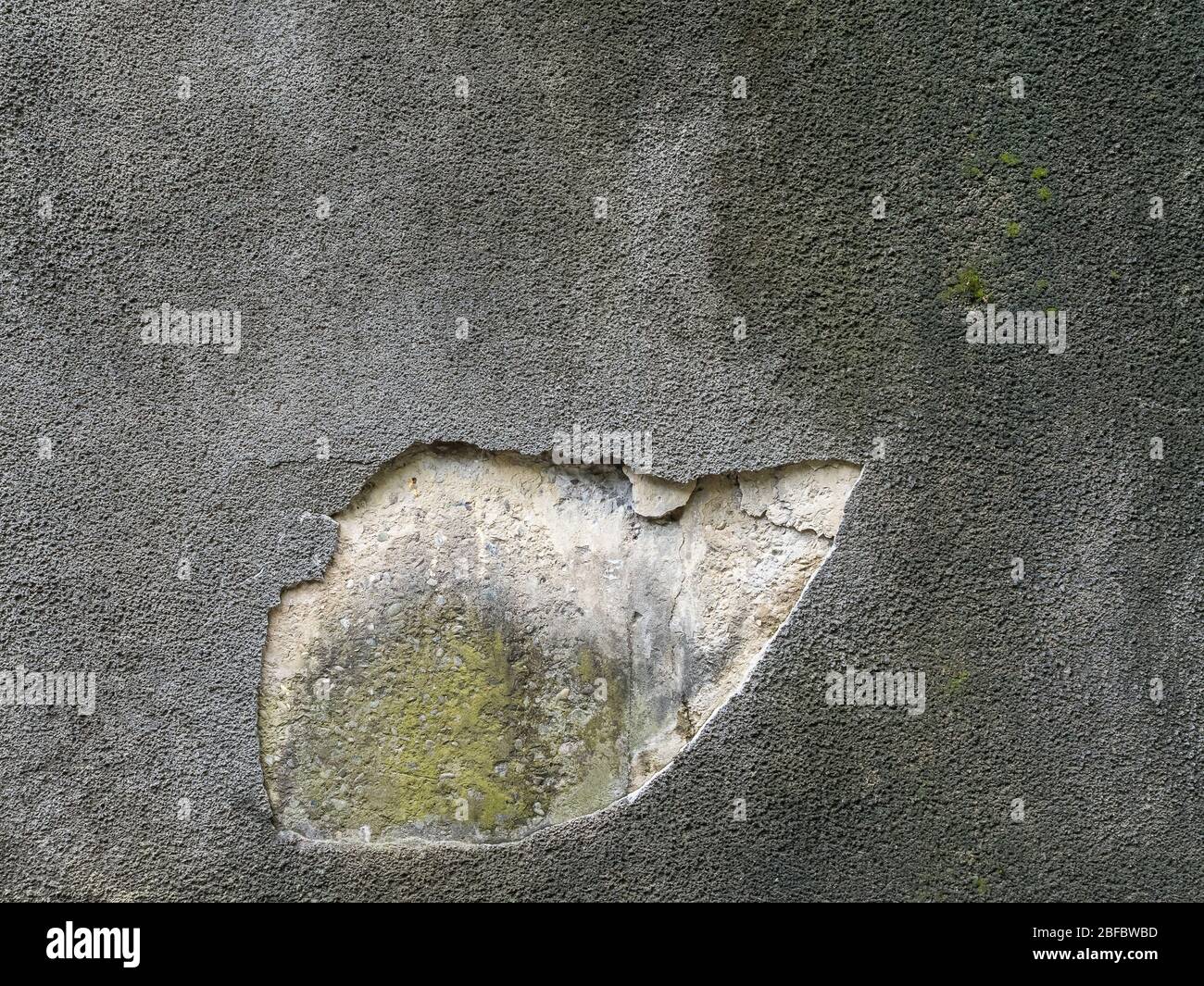 Plaster fell off the wall on the street Stock Photo - Alamy