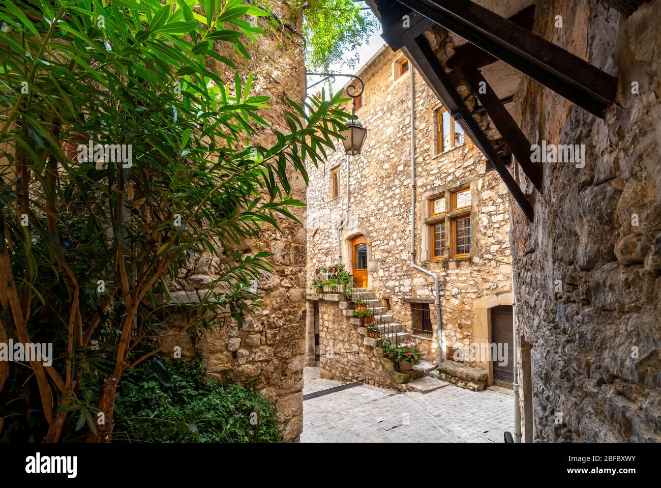 View of an entrance to a home from a back alley in the medieval walled ...