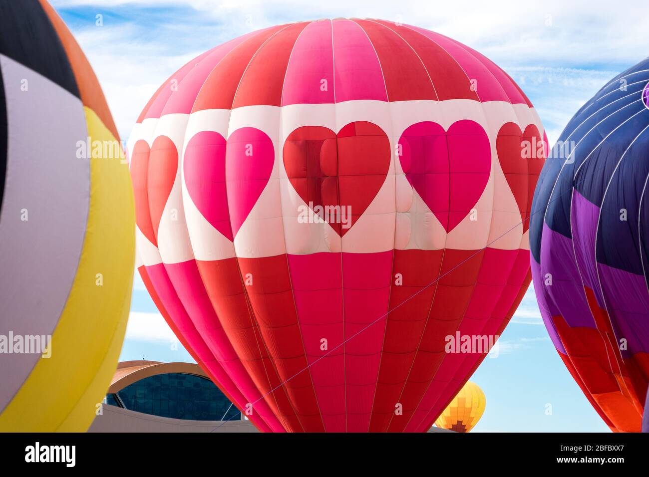 Valentine themed hot air balloons at take off in Al Stock Photo - Alamy