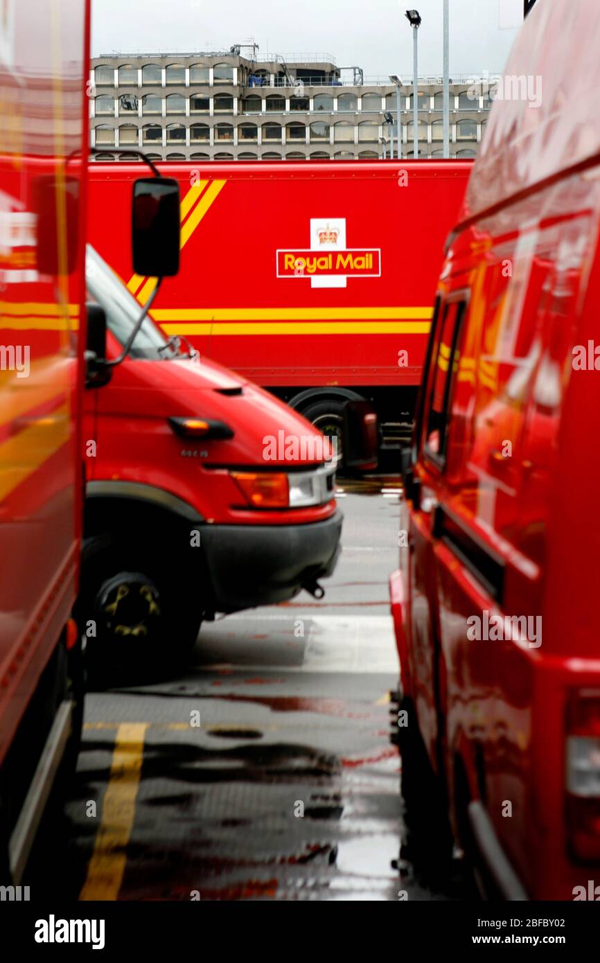 Royal Mail delivery lorries and minivans parked in the car park of the ...