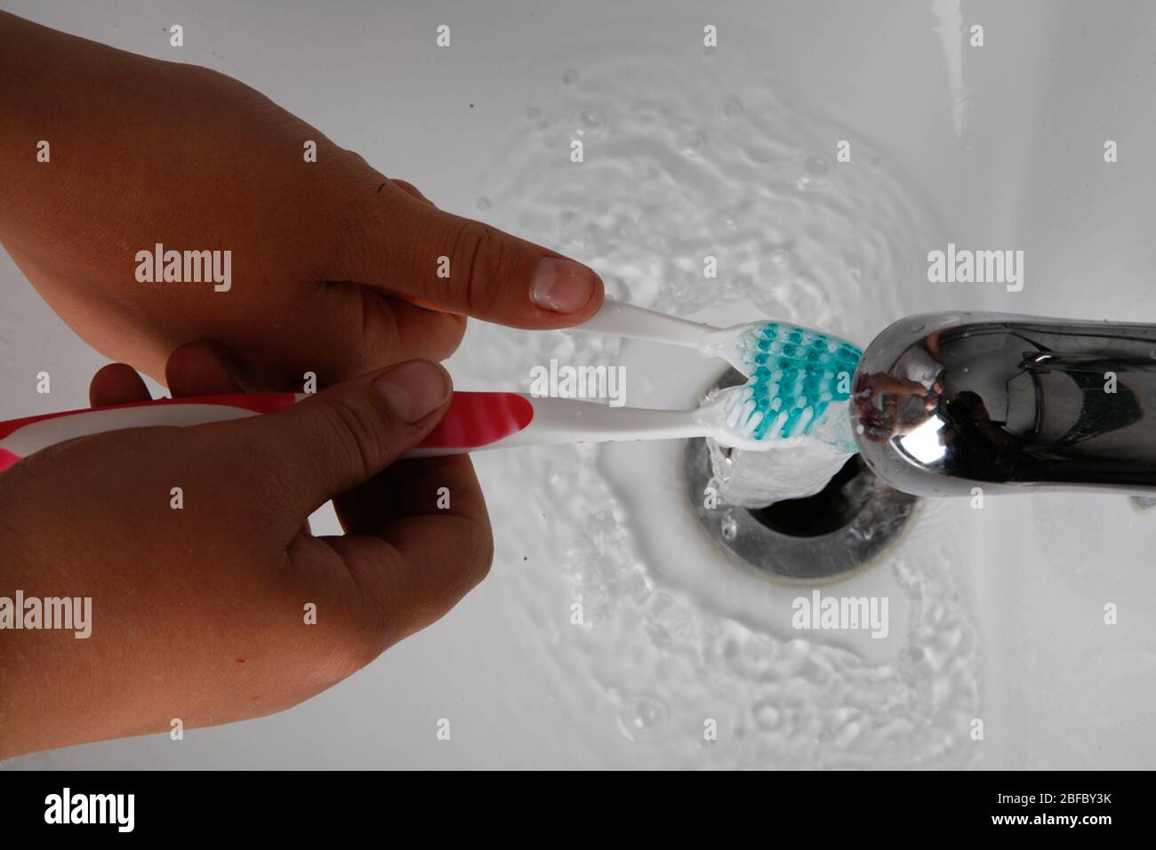 Child brushing teeth tap hi-res stock photography and images - Alamy