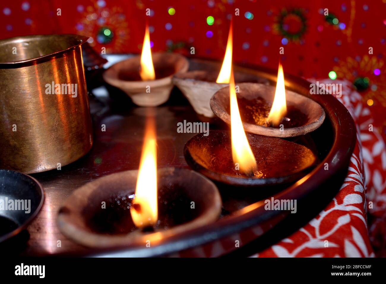 Traditional vintage clay oil lamp burning fire, festival lamp of ...