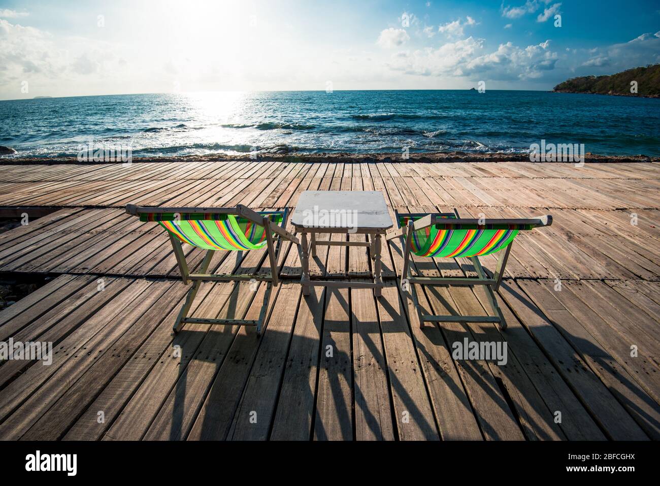 Terrace view of sea waves and coast landscape seascape with bench chair ...