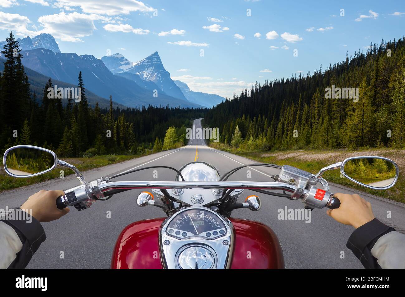 Biker Riding on a Motorcycle on a scenic Road Stock Photo - Alamy
