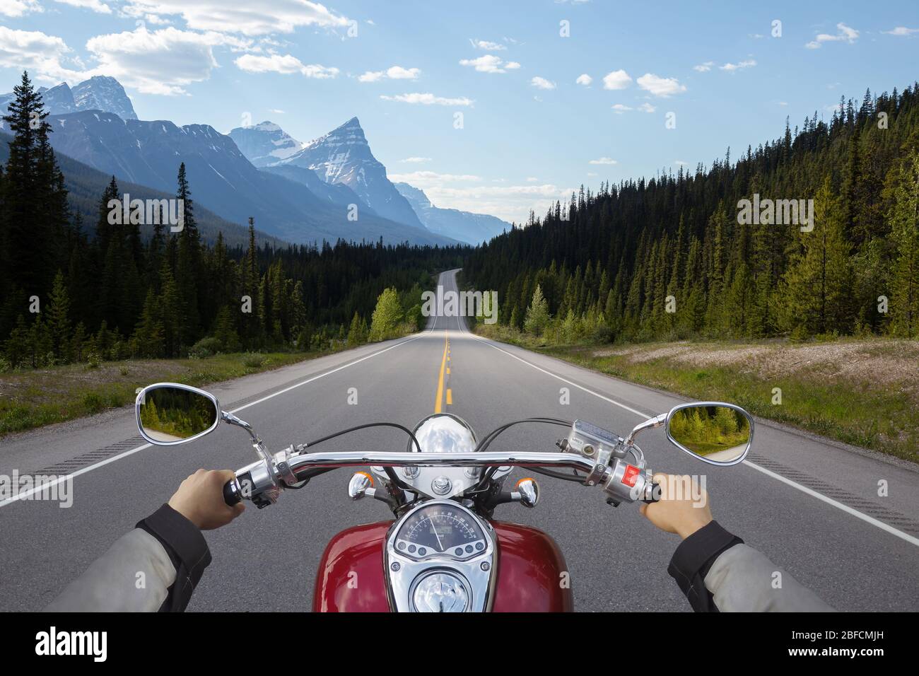Biker Riding on a Motorcycle on a scenic Road Stock Photo - Alamy