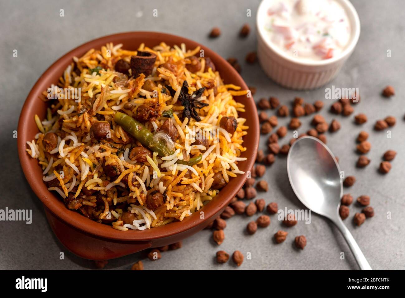Indian Vegetarian Chickpeas Biryani with Raita Stock Photo - Alamy