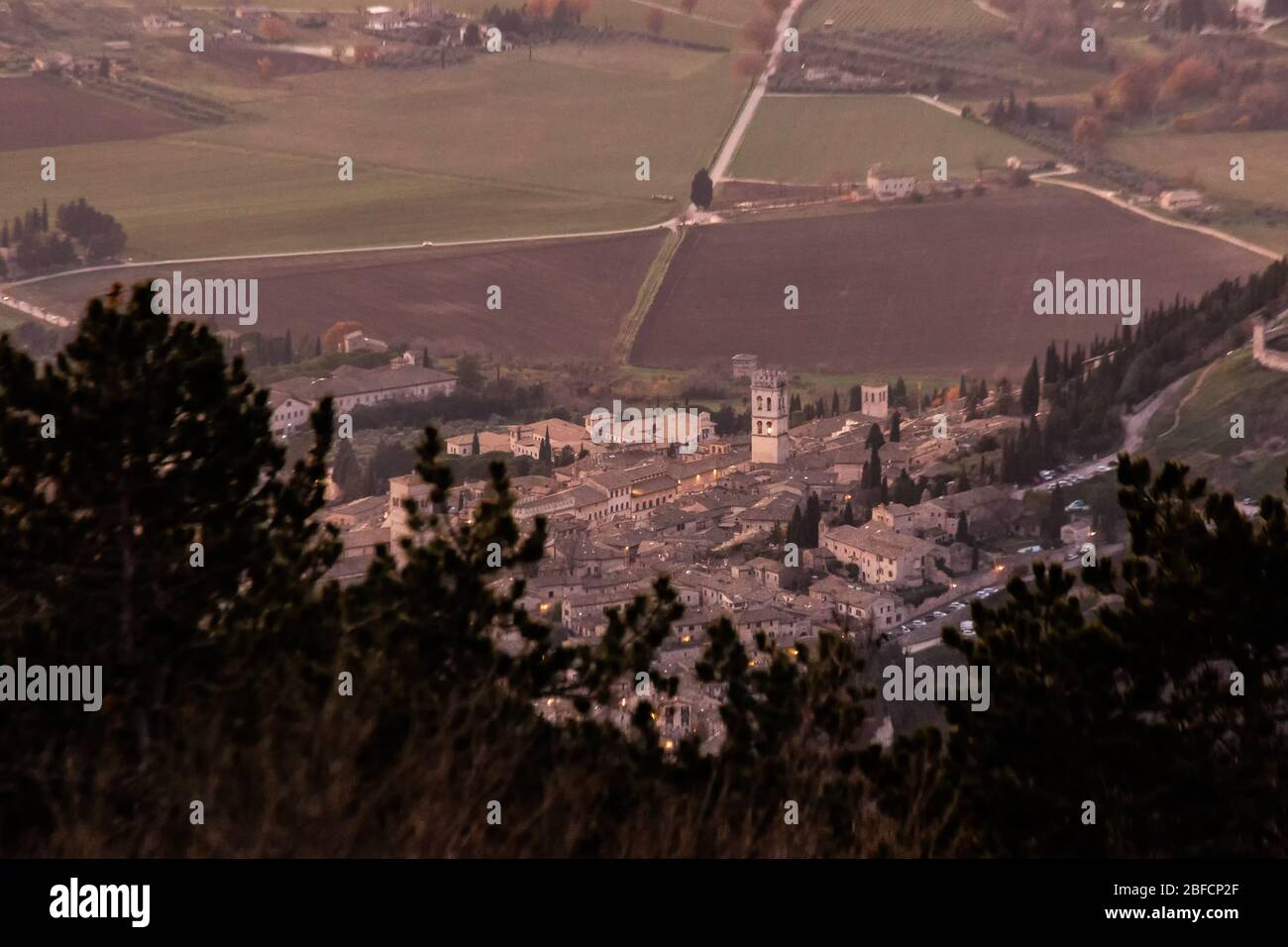 An epic view of Assisi town (Umbria) above valley at sunset Stock Photo ...
