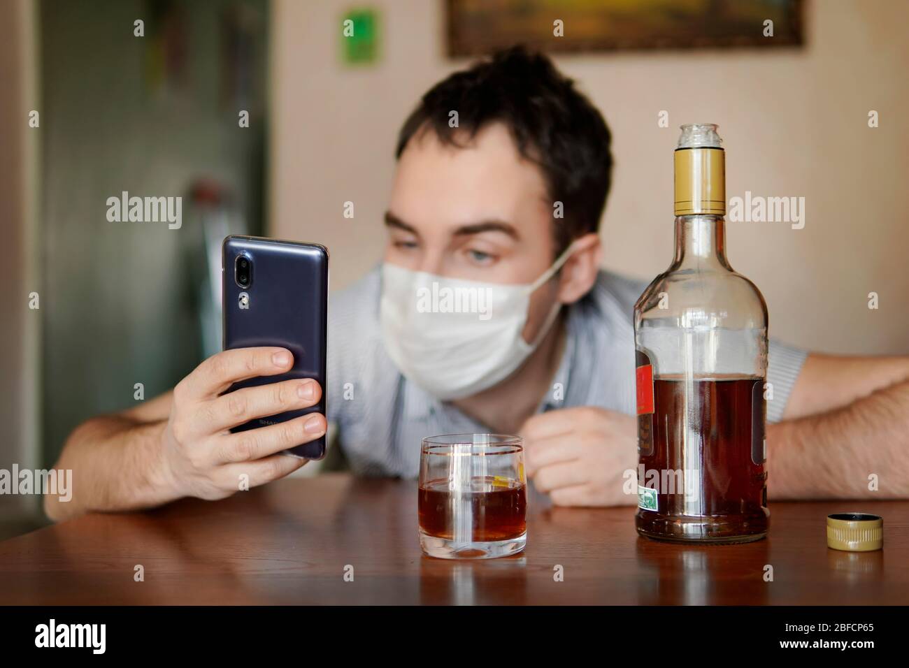 alcoholism, alcohol addiction and people concept - male alcoholic with ...